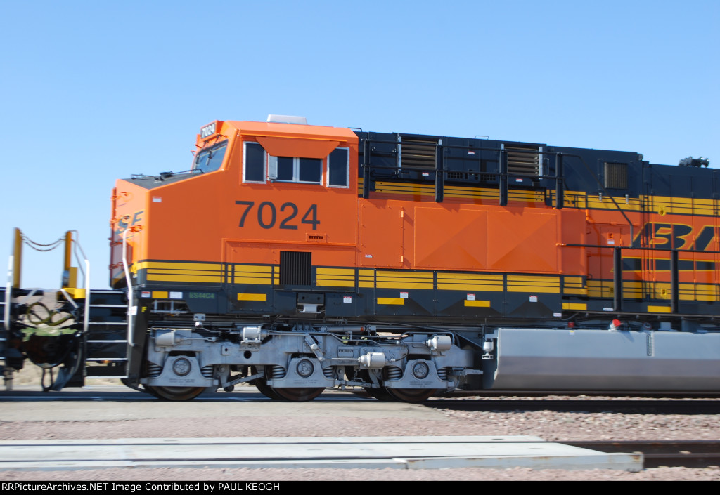 Side Cab Shot of BNSF 7024 as She rolls east as a #3 unit.